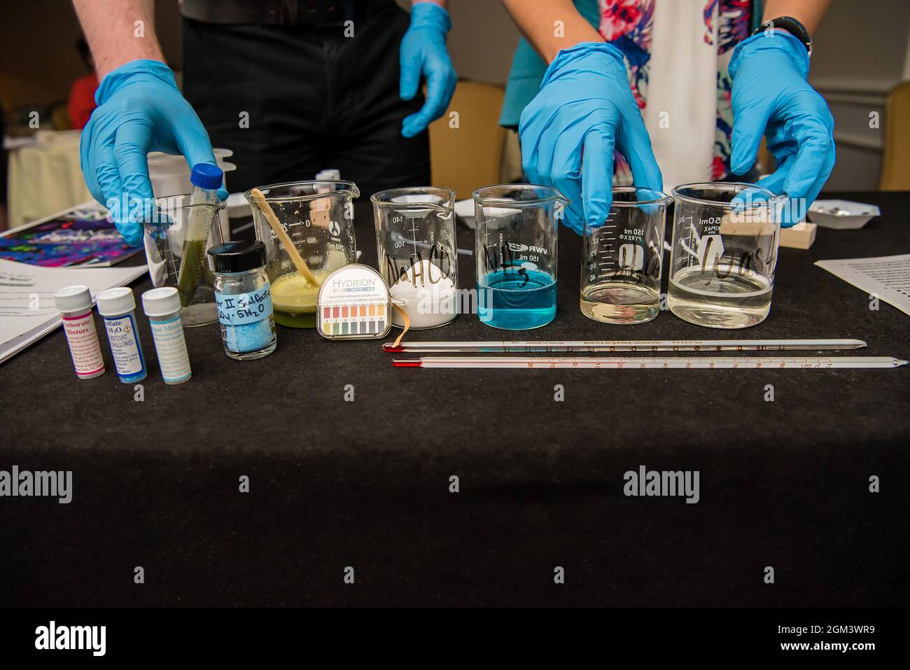 Kids wearing latex gloves for science experiment Stock Photo - Alamy