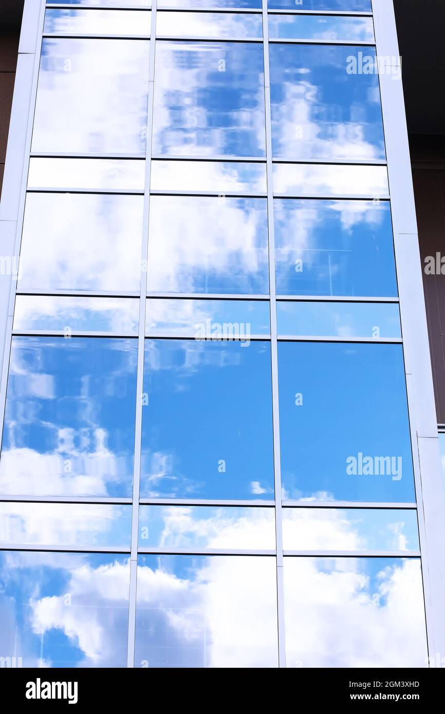 Architectural detail of the facade with multiple reflections of other ...