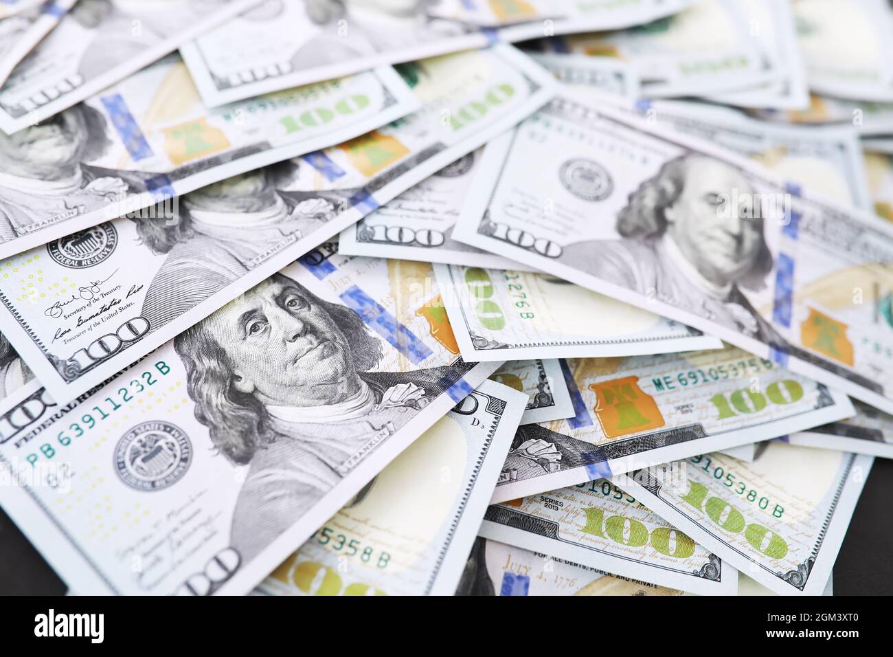 Cash money in a large pile as a finance background. Paper money close ...