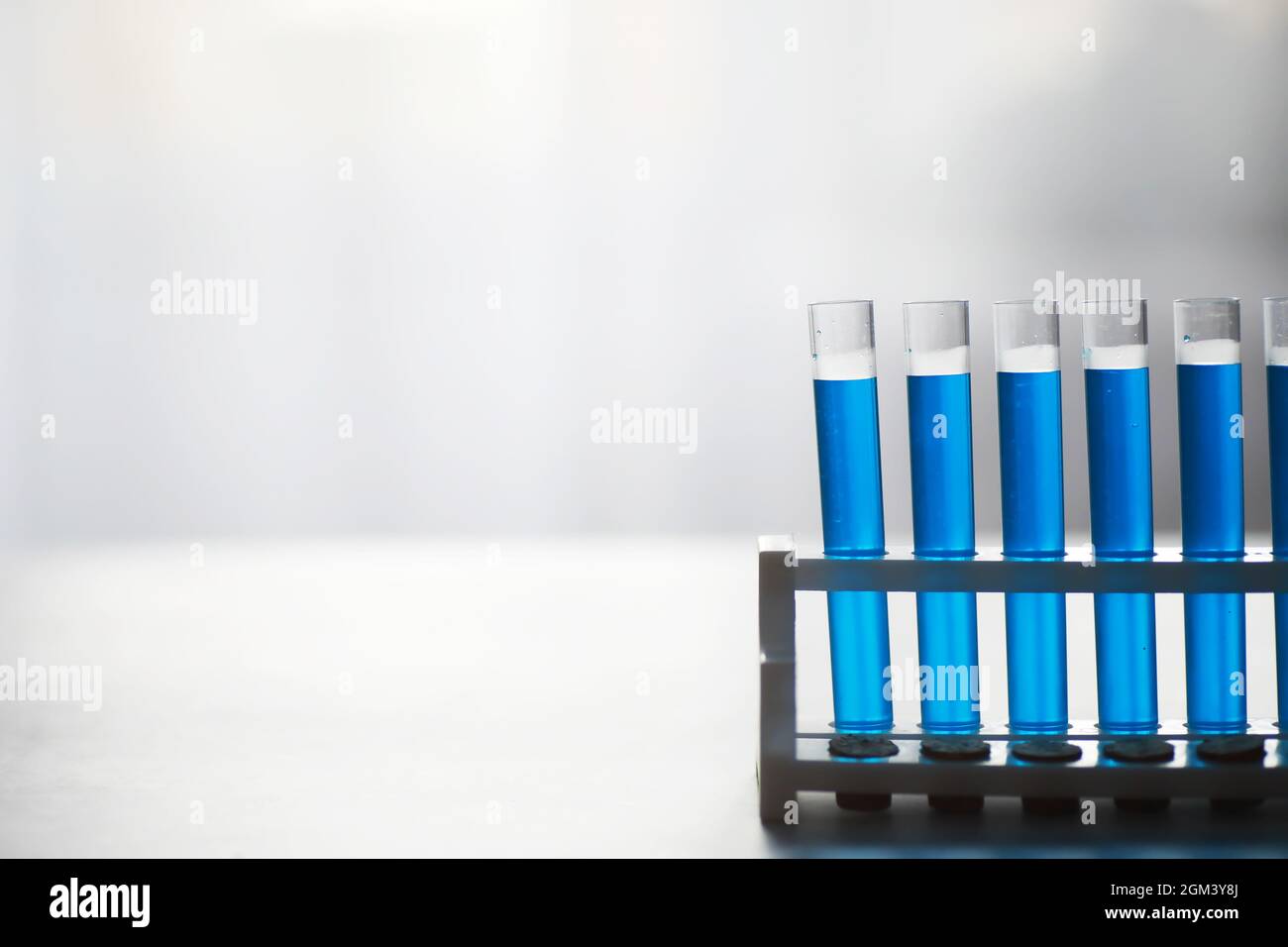 Test tube of glass overflows new liquid solution potassium blue ...
