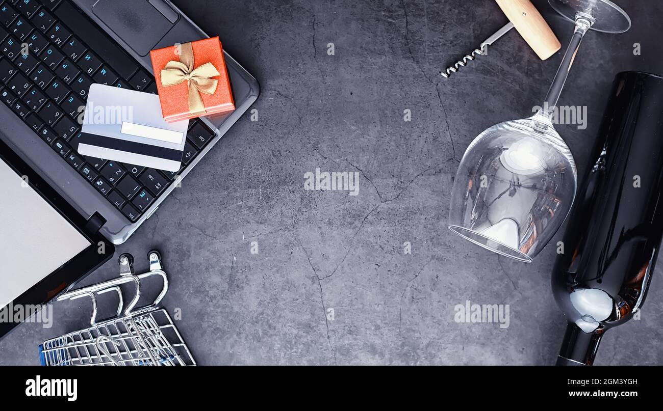 Shopping concept. Supermarket trolley, money and gifts on the ...