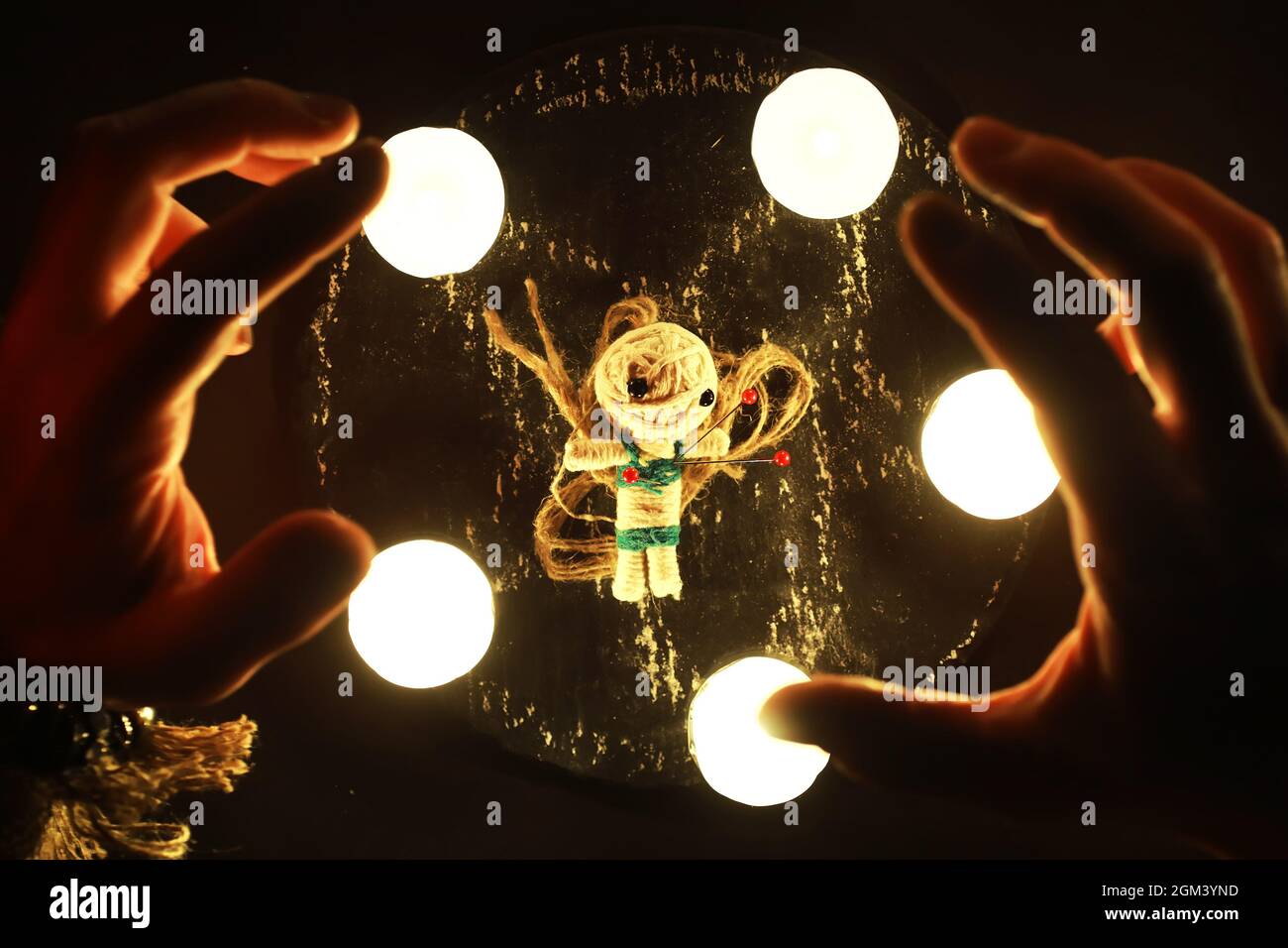 Mystic still life with voodoo doll, the tarot cards, books, evil ...