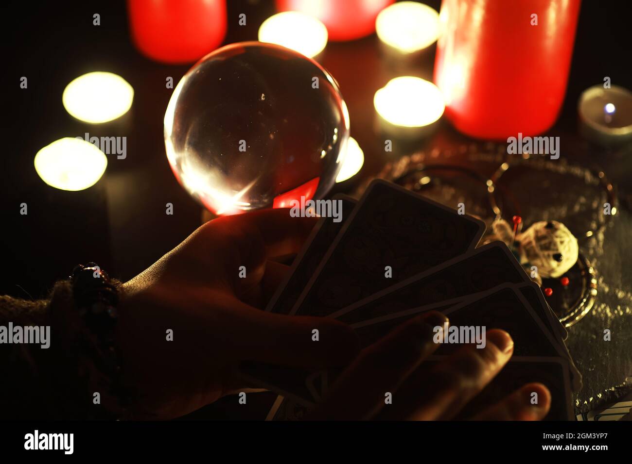 Mystic still life with voodoo doll, the tarot cards, books, evil ...