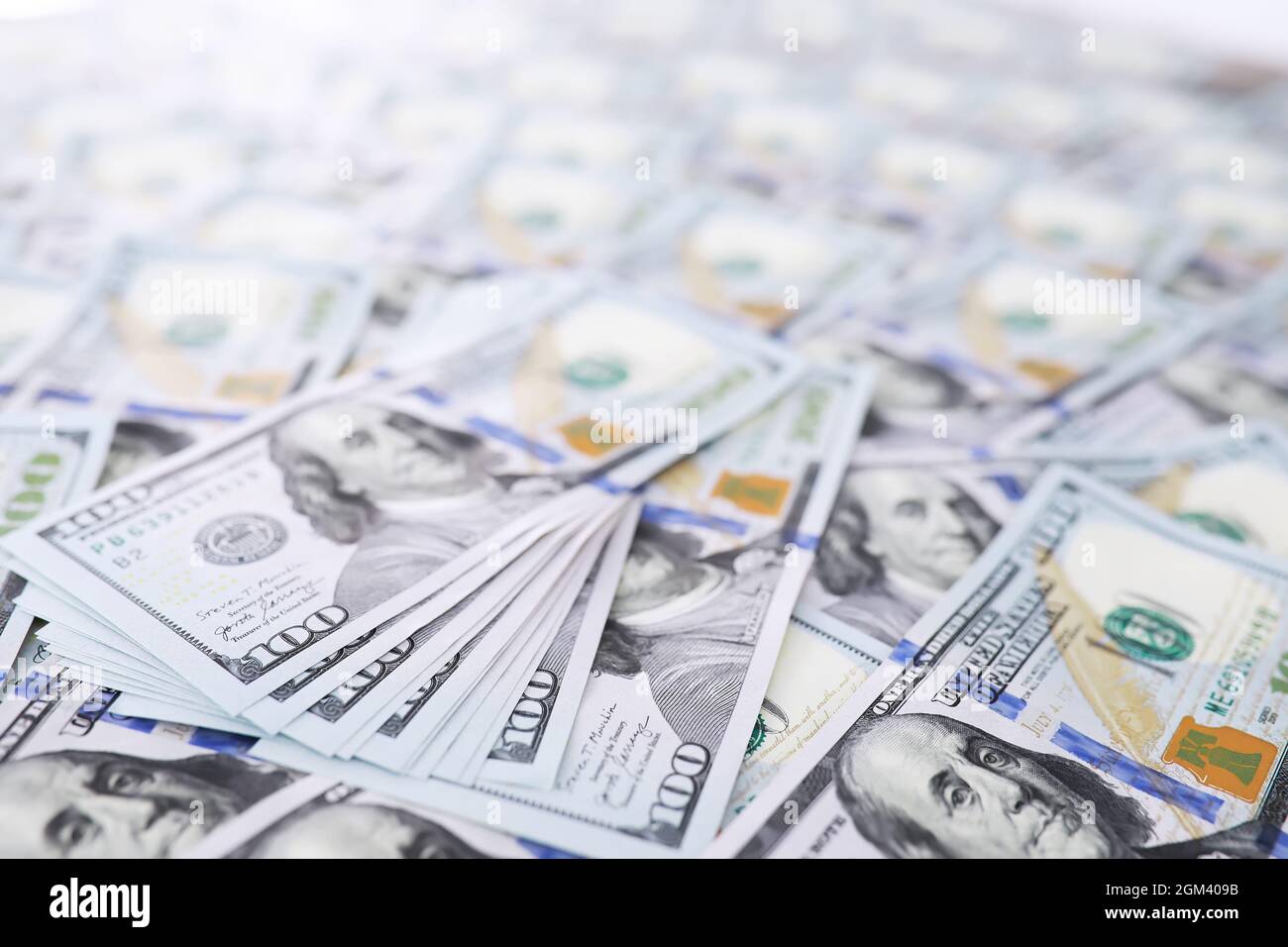 Cash money in a large pile as a finance background. Paper money close ...