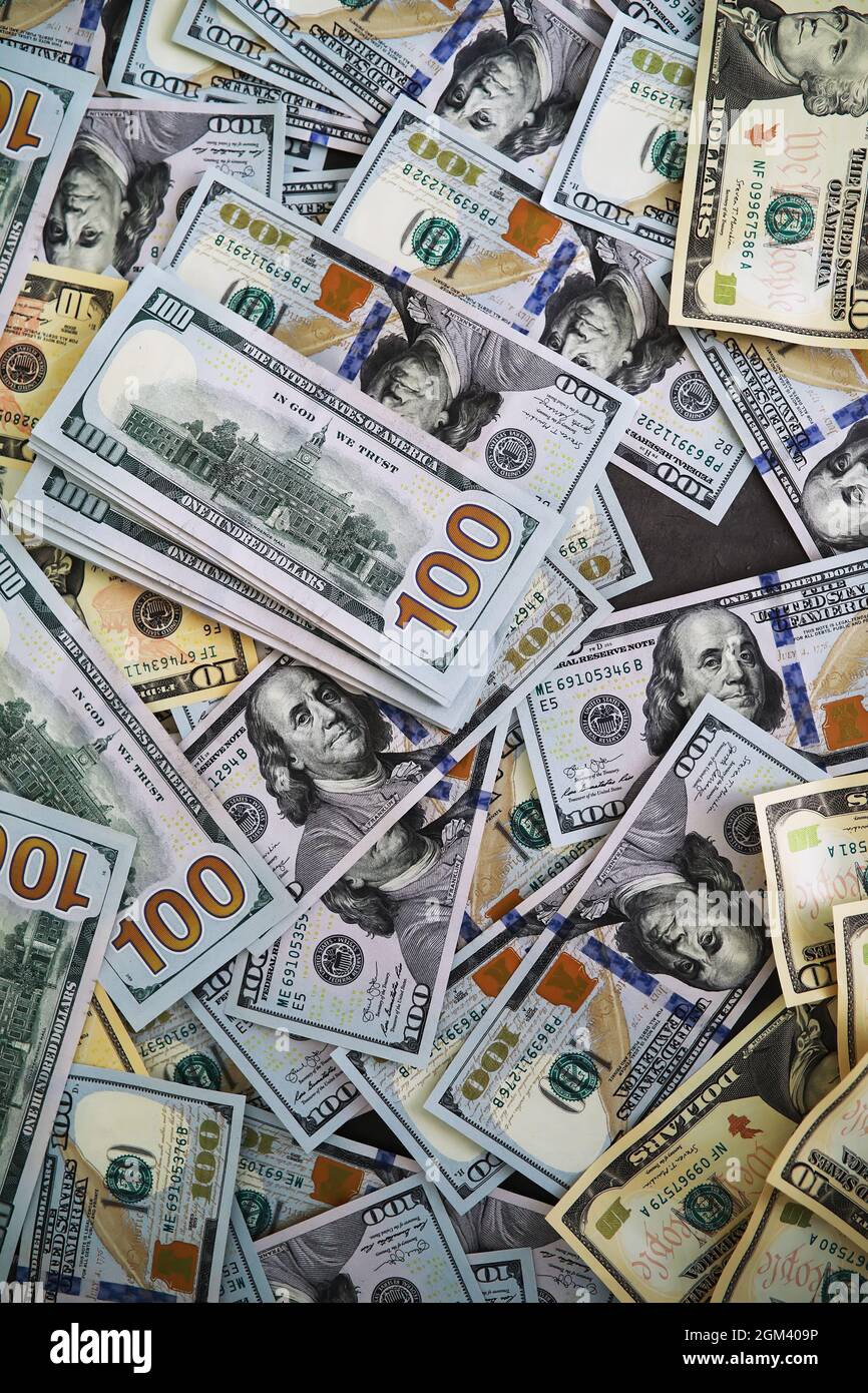 Cash money in a large pile as a finance background. Paper money close ...