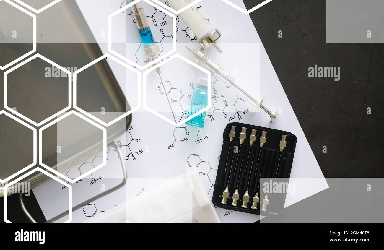 small jars with injection and syringe for injection on blue background ...