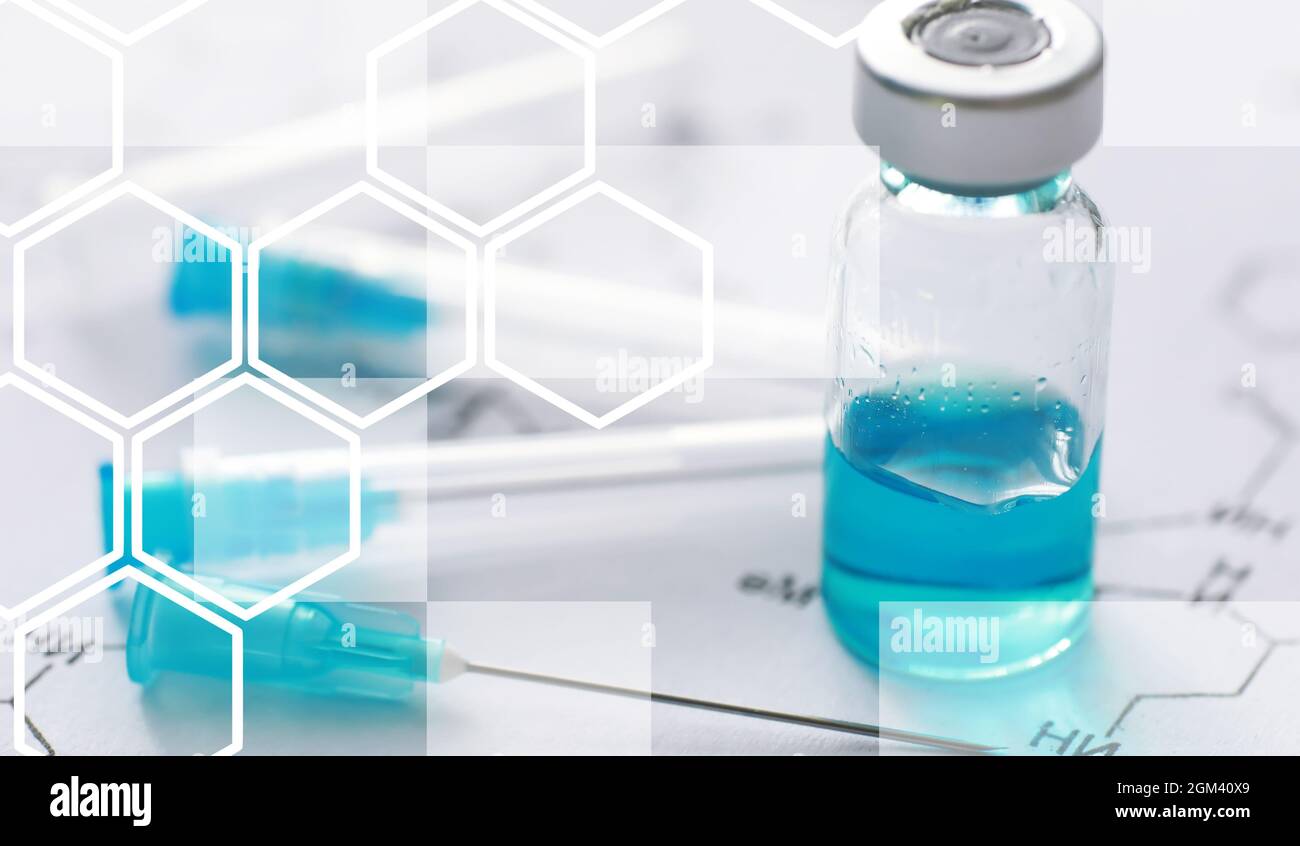 small jars with injection and syringe for injection on blue background ...