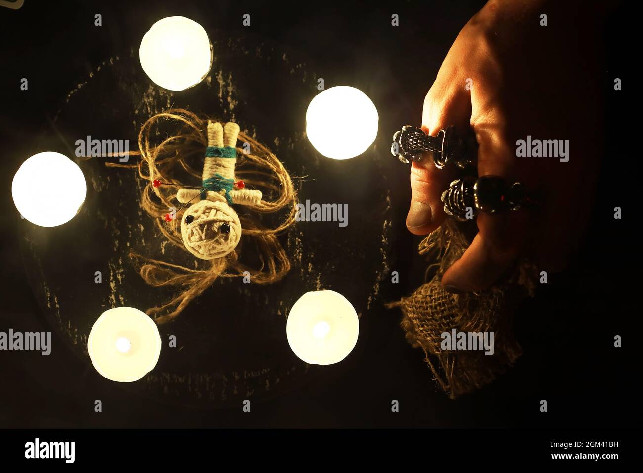 Mystic still life with voodoo doll, the tarot cards, books, evil ...