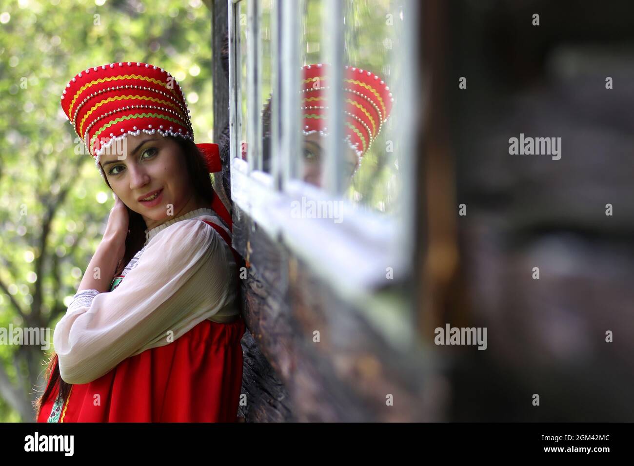 Slav woman in traditional dress wooden wall Stock Photo - Alamy