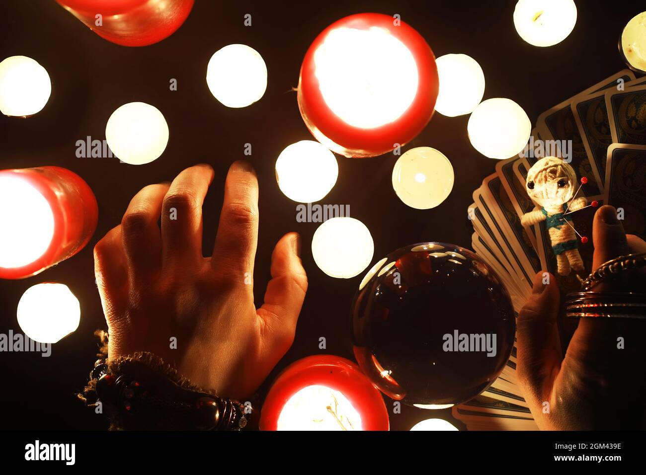 Mystic still life with voodoo doll, the tarot cards, books, evil ...