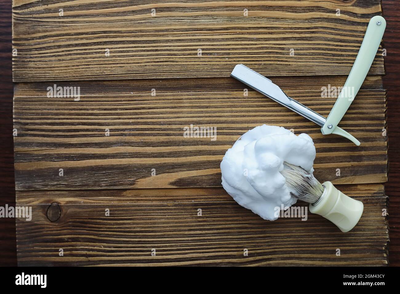 Shaving accessories on a wooden texture background. Tools. Disposable ...