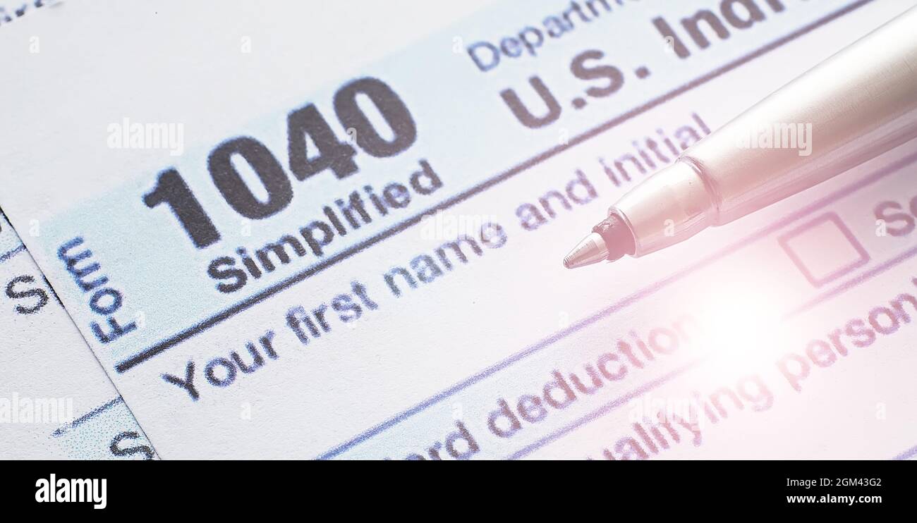 Annual tax reporting. Tax form on the table. Financial statements ...
