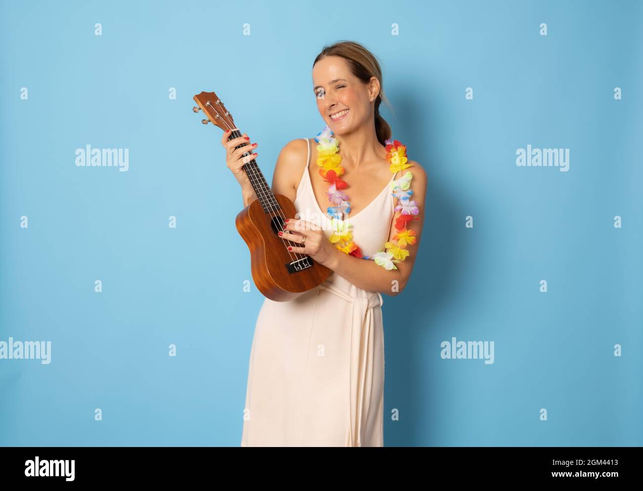 Ukulele woman playing festival hi-res stock photography and images - Alamy