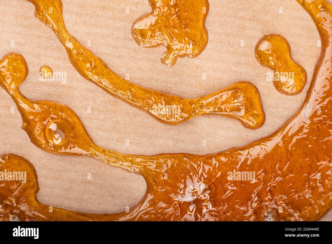 piace golden dab concentrate of cannabis wax flat lay on yellow ...