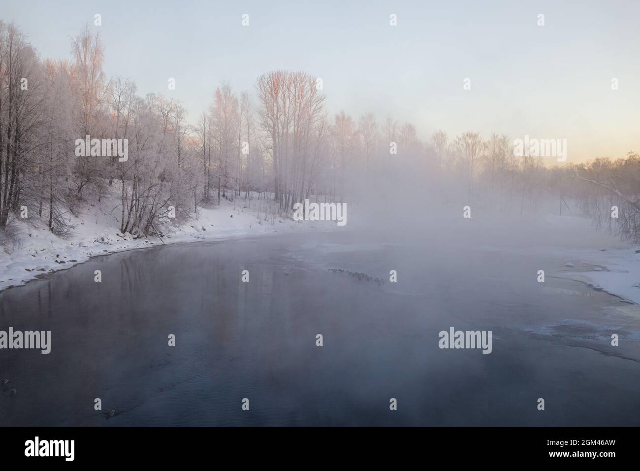 Natural frosty winter background. Steam rises above the water of a non ...