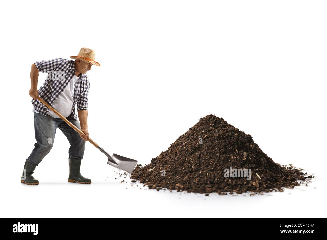 Full length profile shot of a mature farmer digging a pile of earth ...