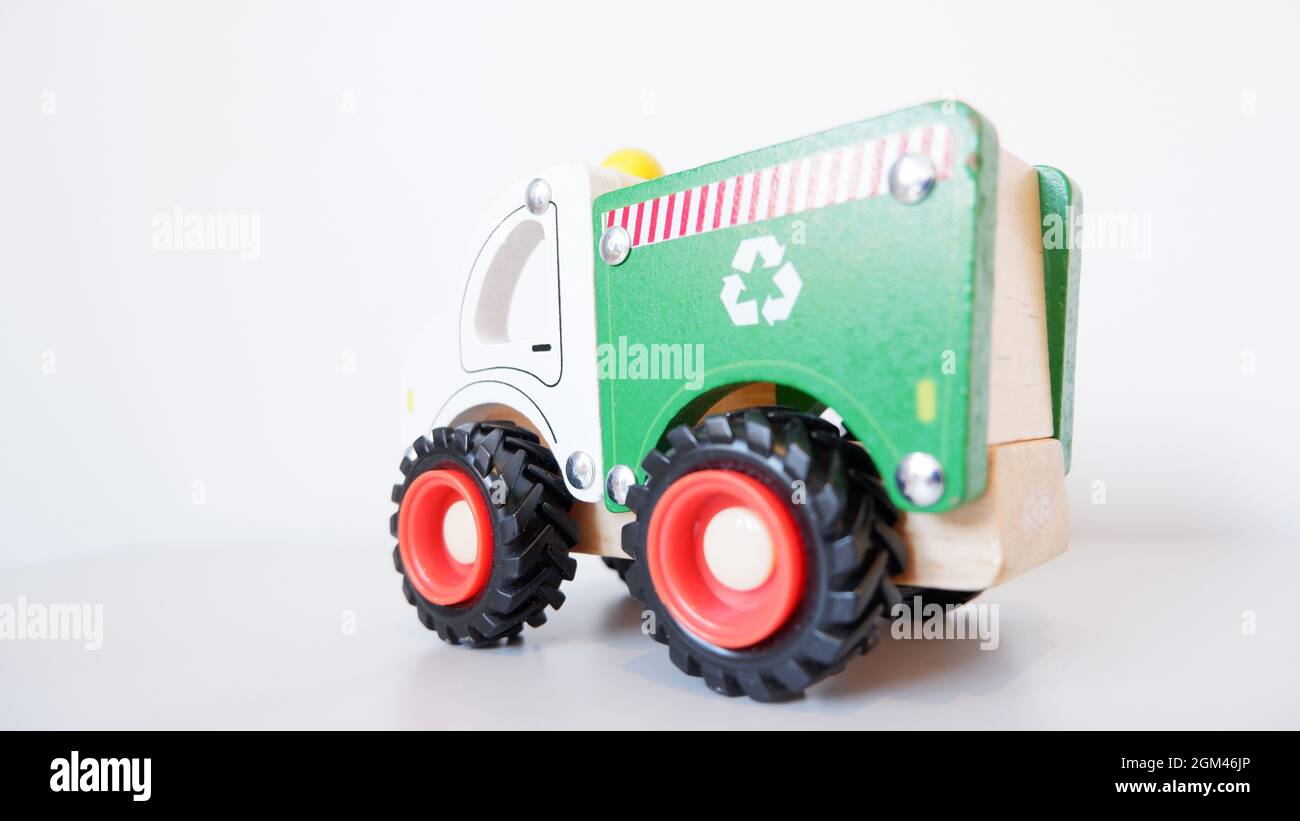 Closeup of a recycling toy truck on a white background Stock Photo - Alamy
