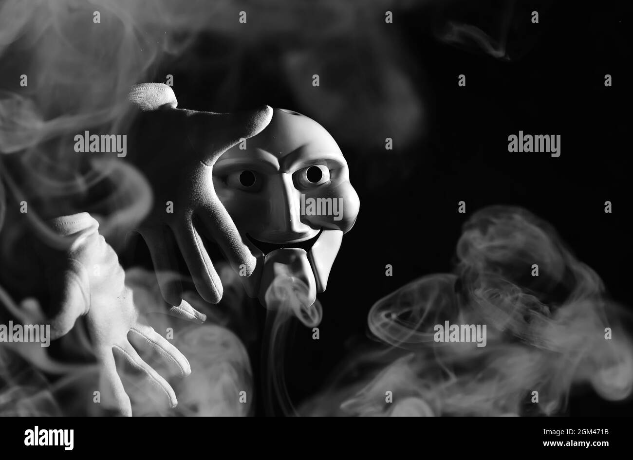 White scary mask on a black background with whites hands Stock Photo ...