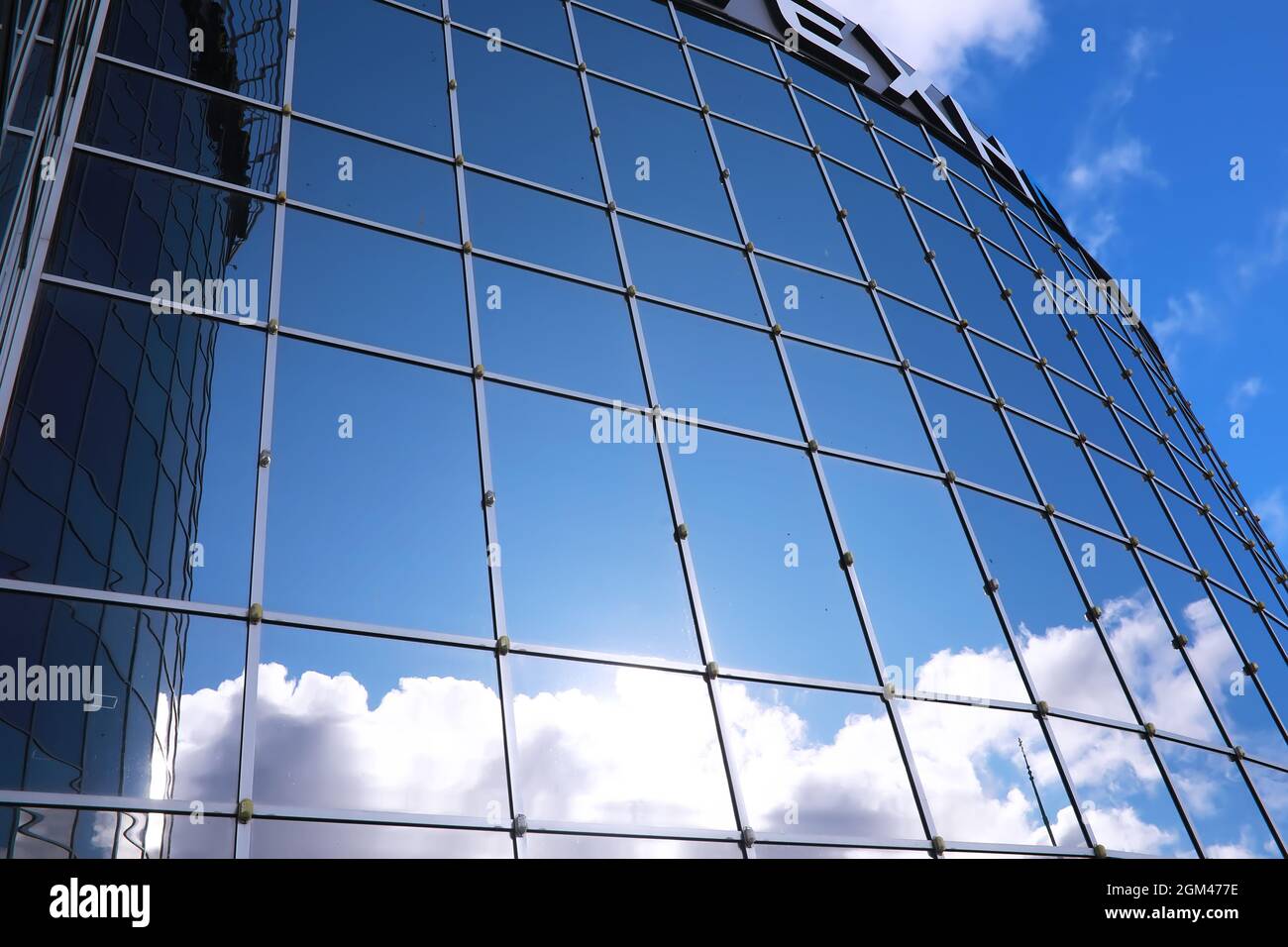 Architectural detail of the facade with multiple reflections of other ...