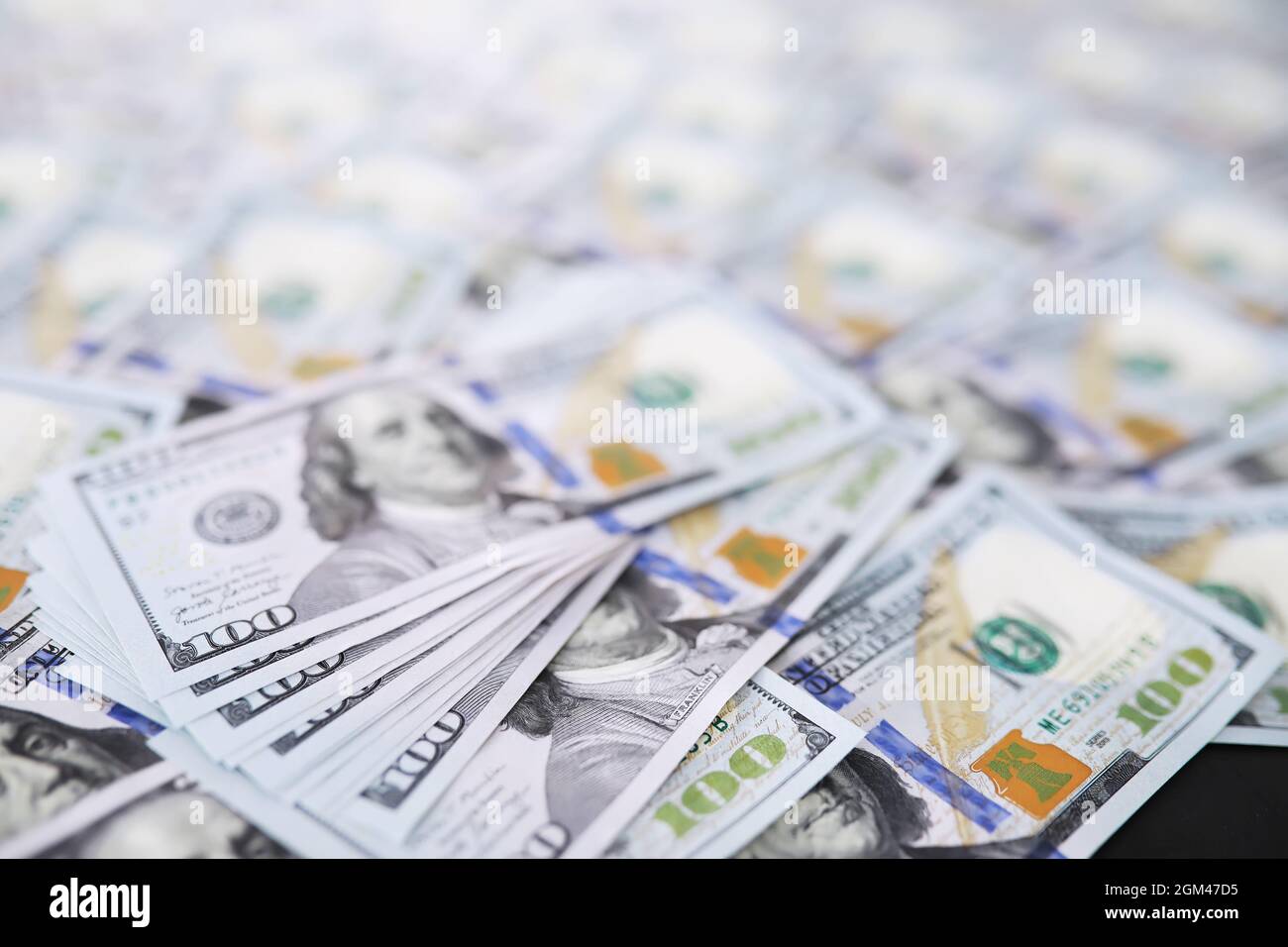 Cash money in a large pile as a finance background. Paper money close ...