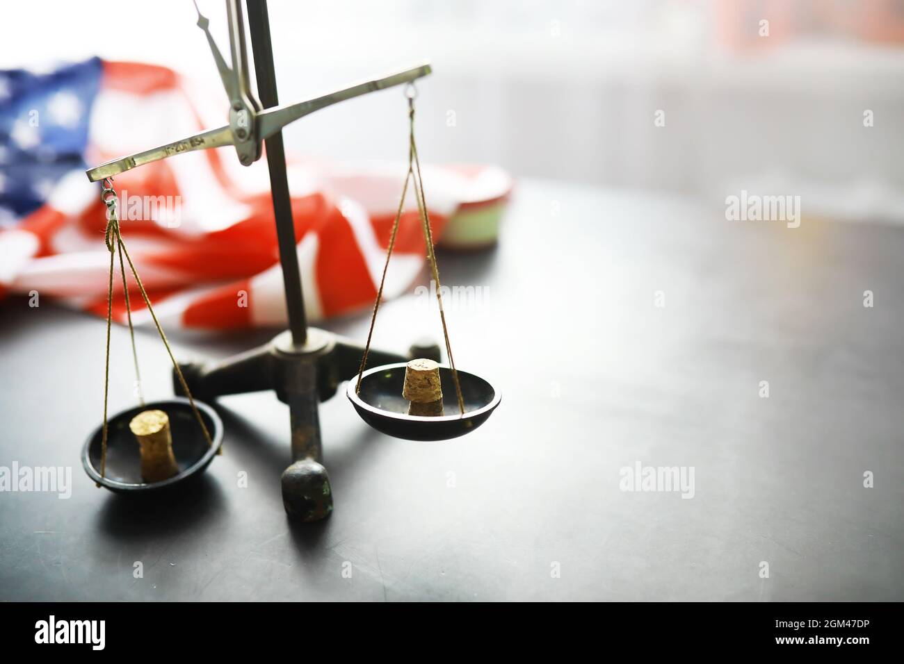 United States Law, scales of justice and American flag. Concept. Money ...