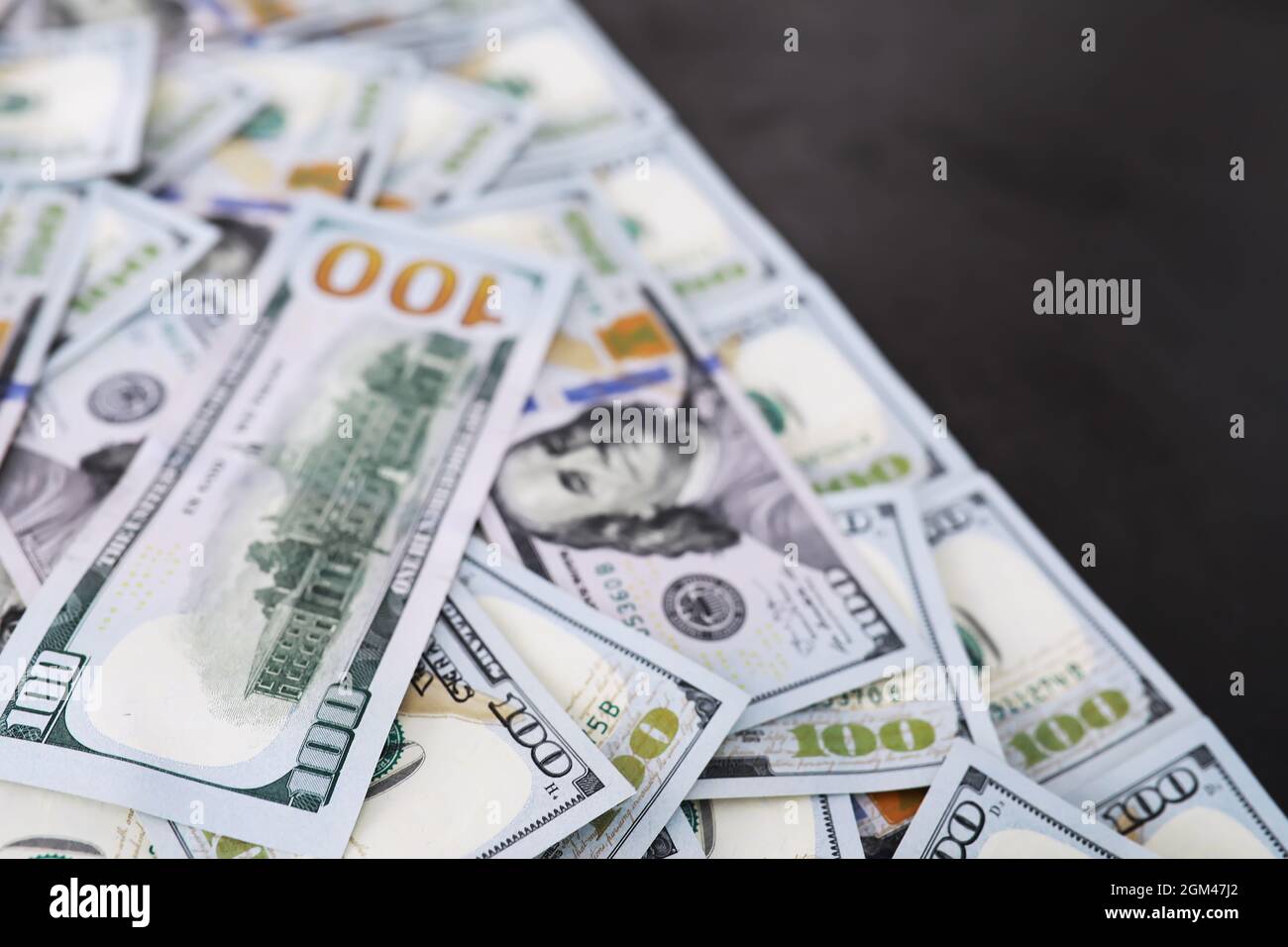 Cash money in a large pile as a finance background. Paper money close ...