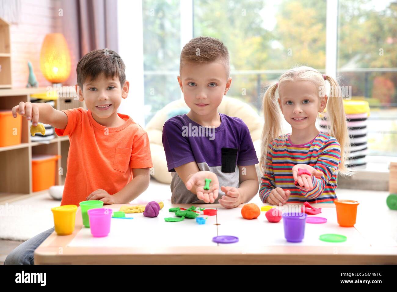 Little girl playing playdough in hi-res stock photography and images ...