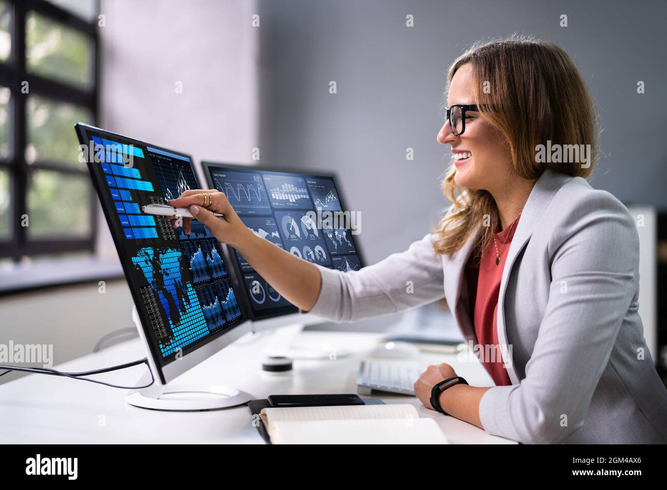 Analyst Women Looking At KPI Data On Computer Screen Stock Photo - Alamy