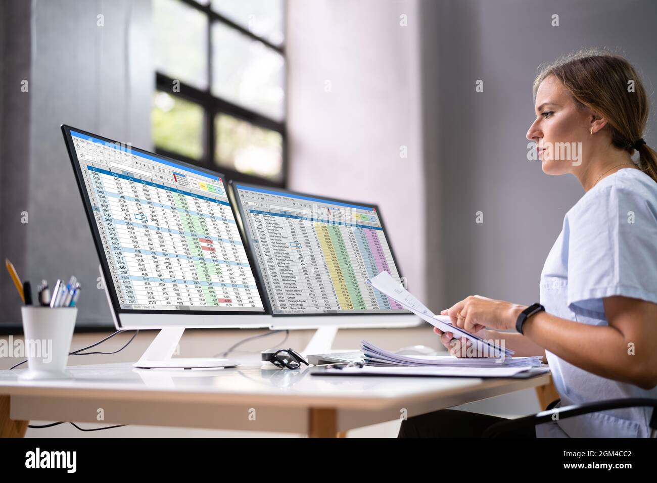 Medical Bill Codes And Spreadsheet Data. Business Analyst Woman Stock ...