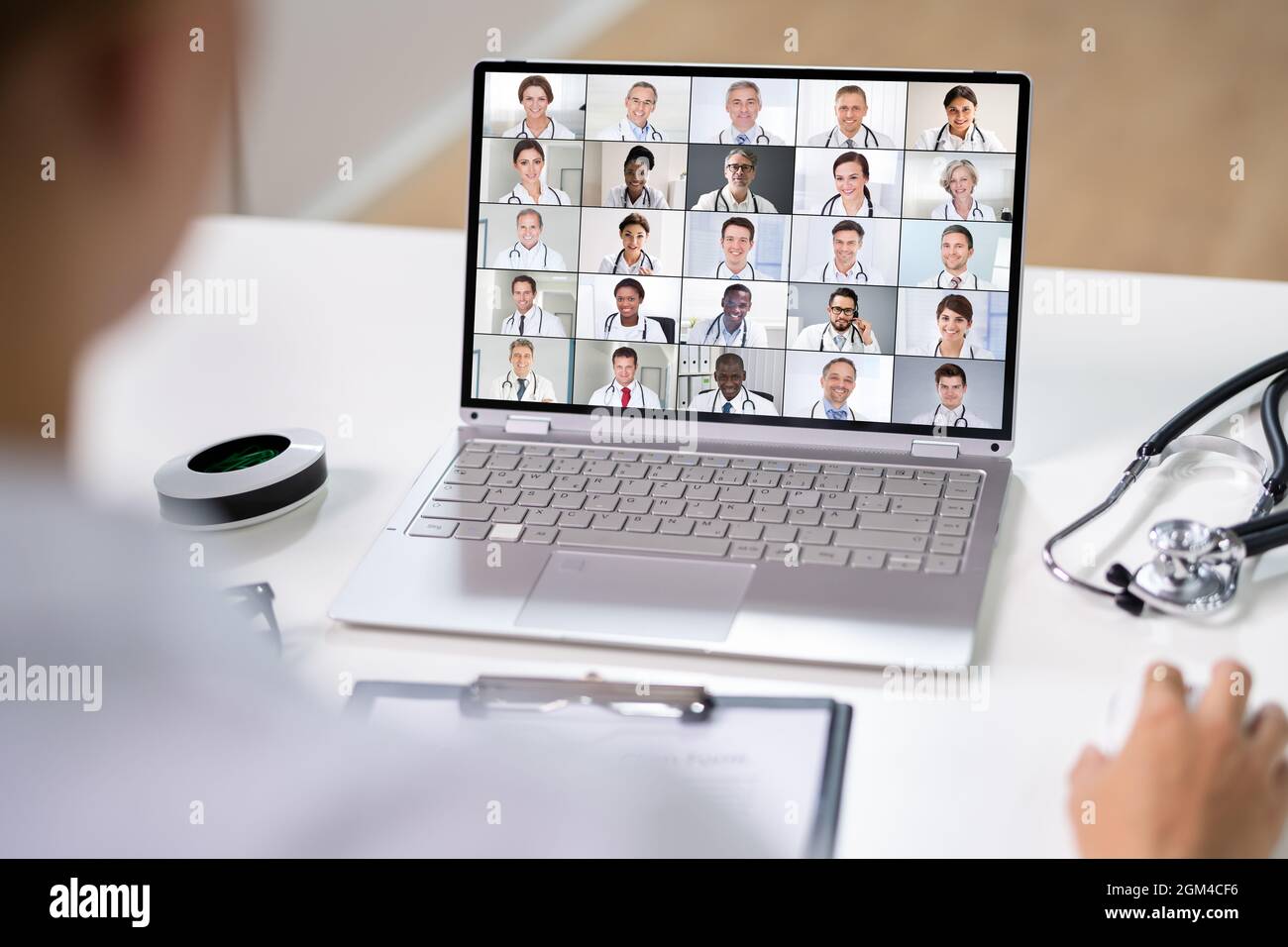 Doctor In Online Medical Video Conference With Diverse Team Of Hospital ...