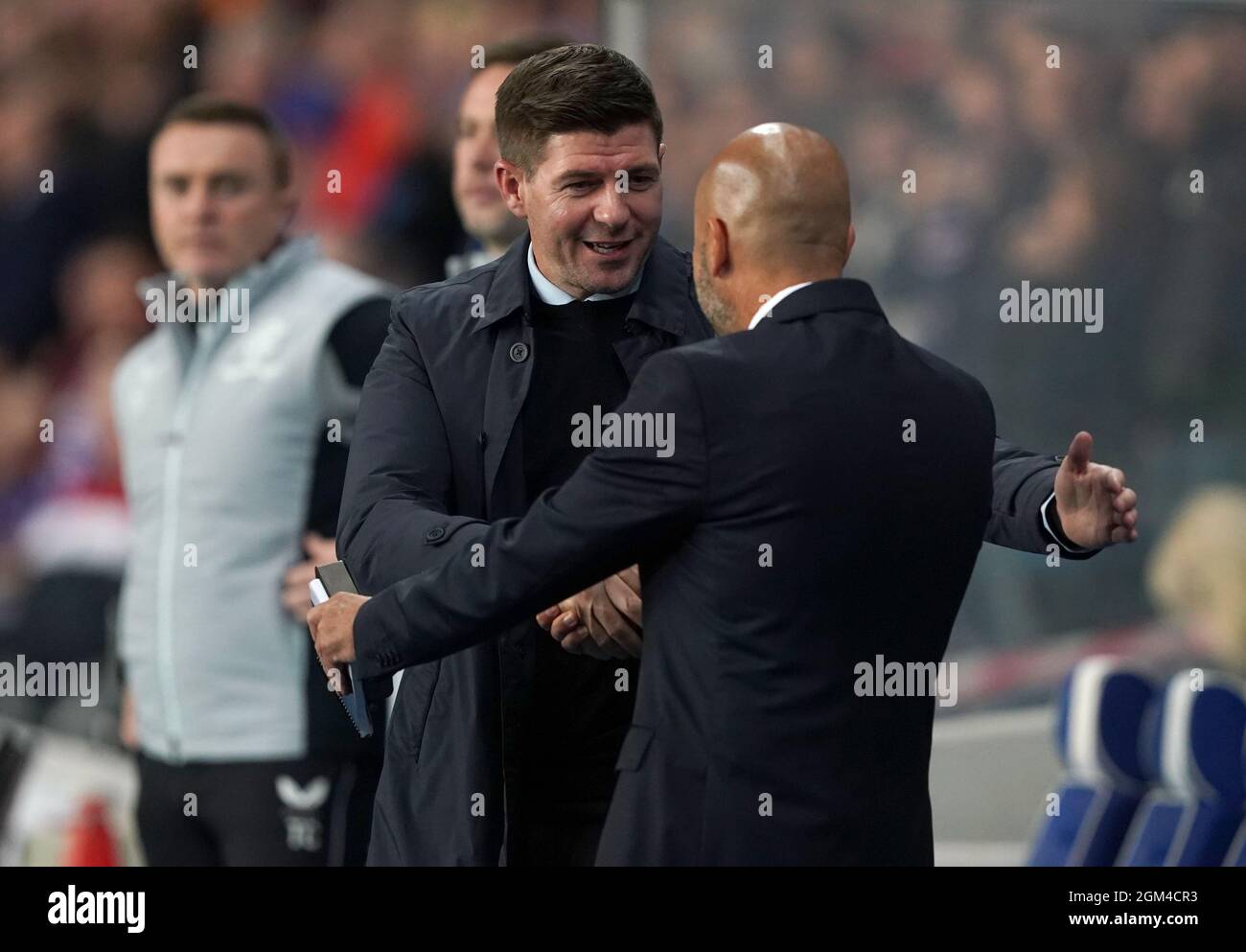Rangers manager Steven Gerrard (left) and Lyon manager Peter Bosz ...