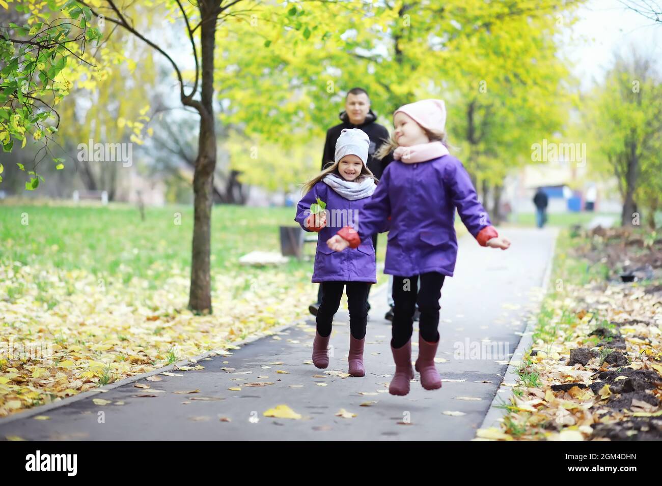 Children for a walk in autumn park. Leaf fall in the park. Family. Fall ...