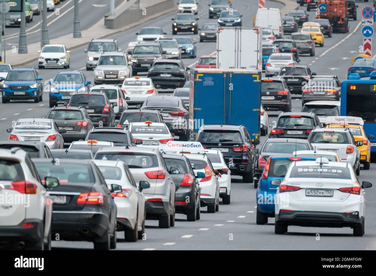 Traffic on a multi-lane road in big city center downtown, day time ...