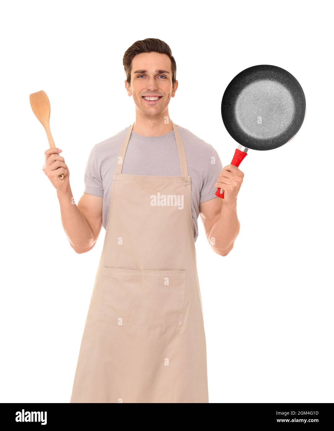 Young man holding pan spatula hi-res stock photography and images - Alamy