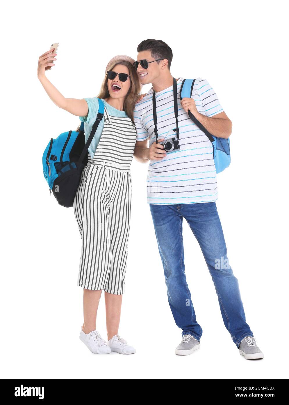 Happy tourists taking selfie on white background Stock Photo - Alamy