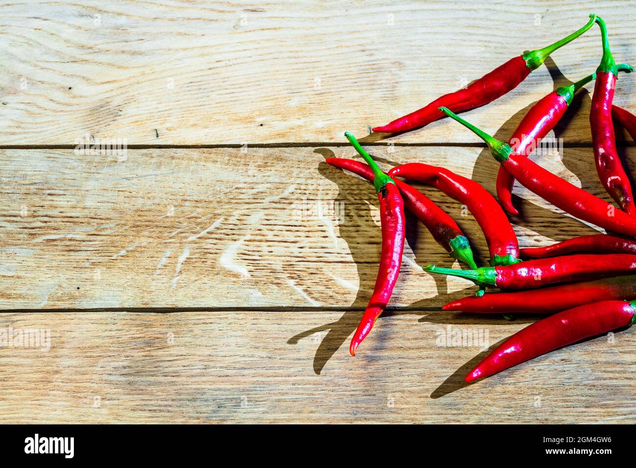 Top view of red hot peppers on a wooden table - copy space Stock Photo ...