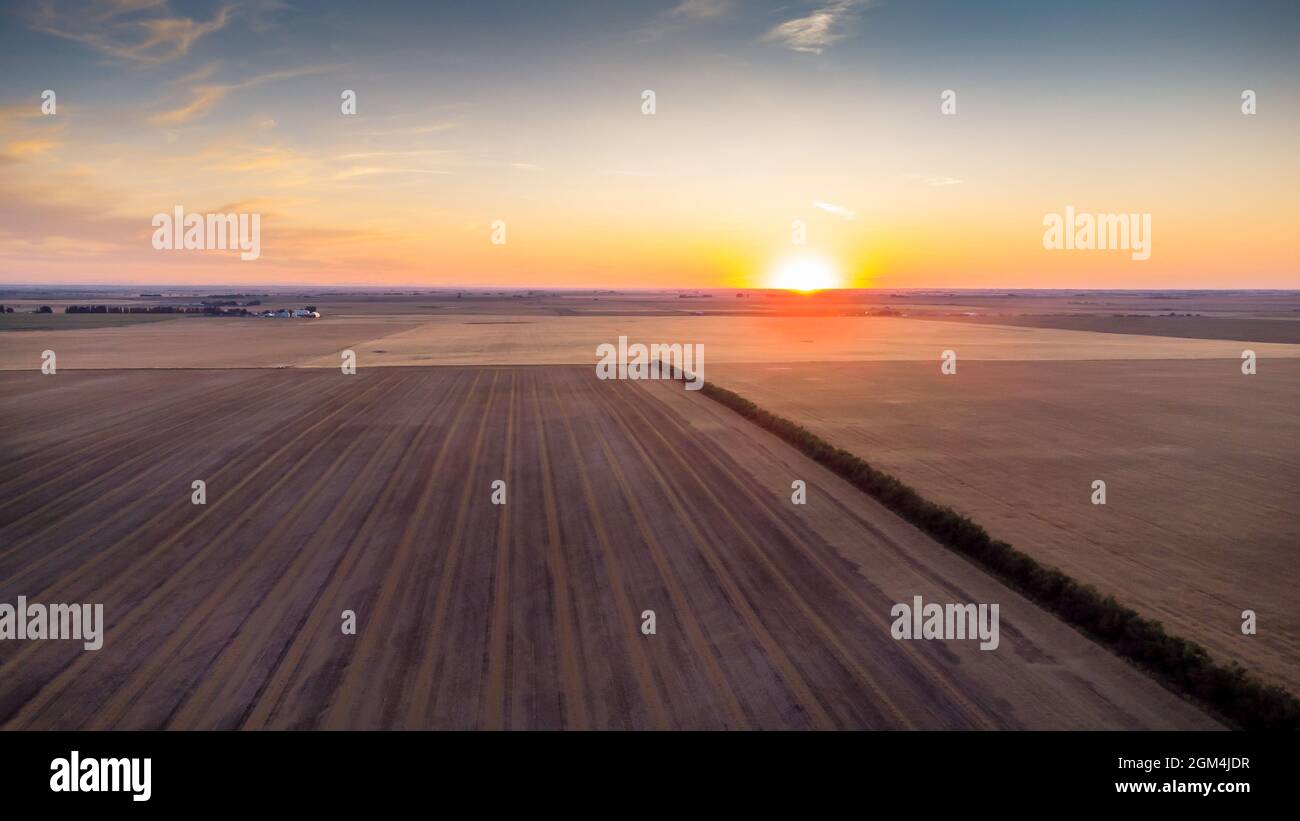 Aerial view of the Canadian prairies during harvest in Rockyview County ...