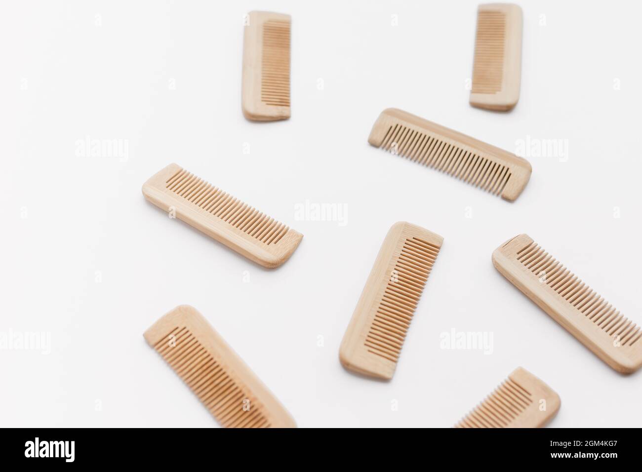 wooden combs scattered isolated on white background, flat lay, top view ...