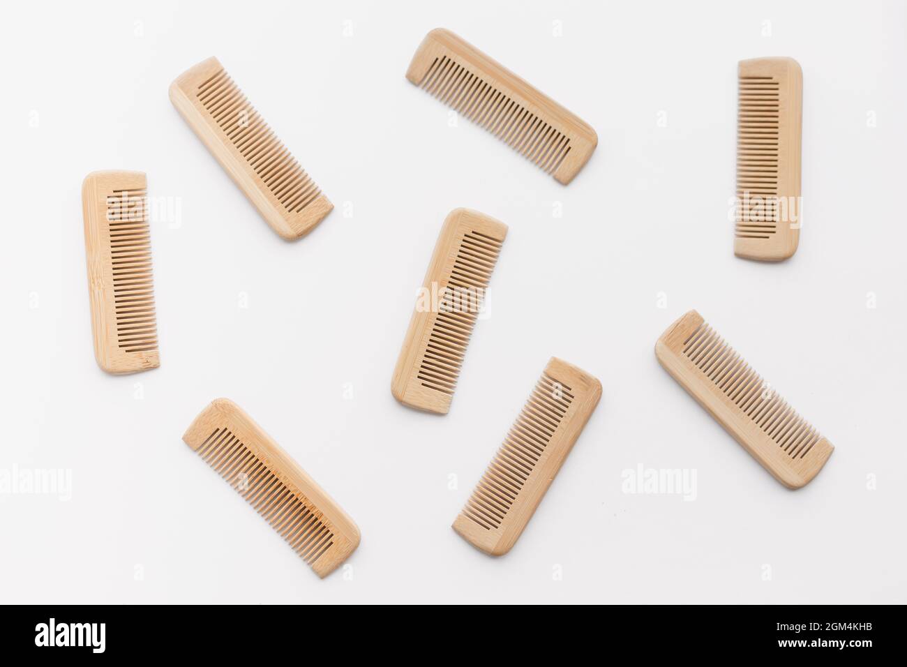 wooden combs scattered isolated on white background, flat lay, top view ...
