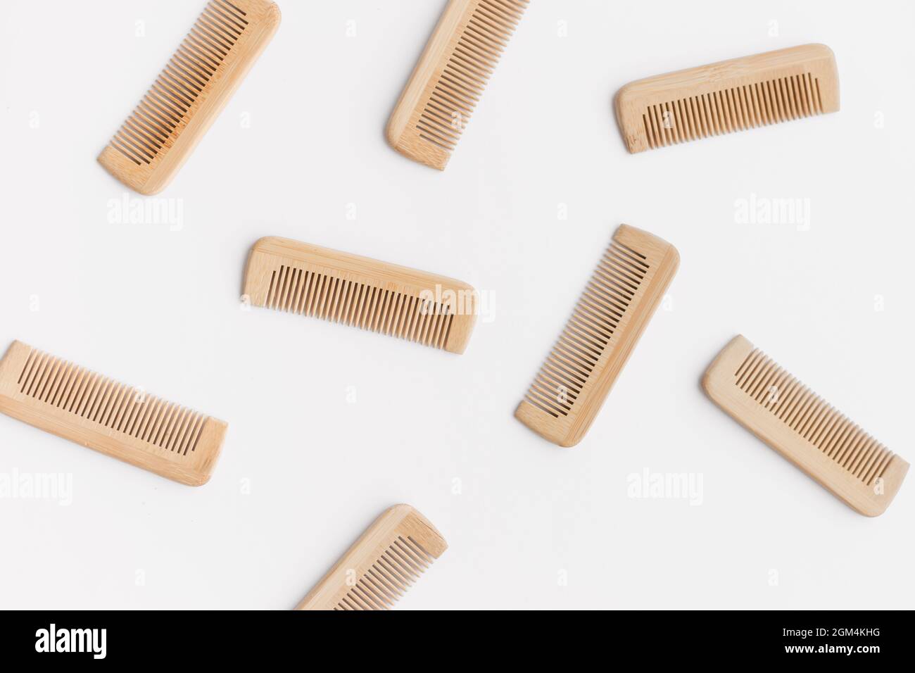 wooden combs scattered isolated on white background, flat lay, top view ...