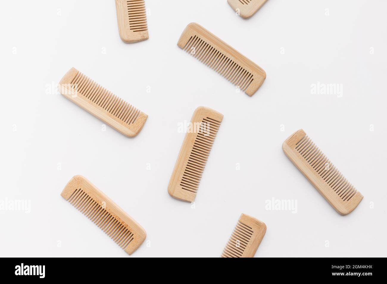 wooden combs scattered isolated on white background, flat lay, top view ...