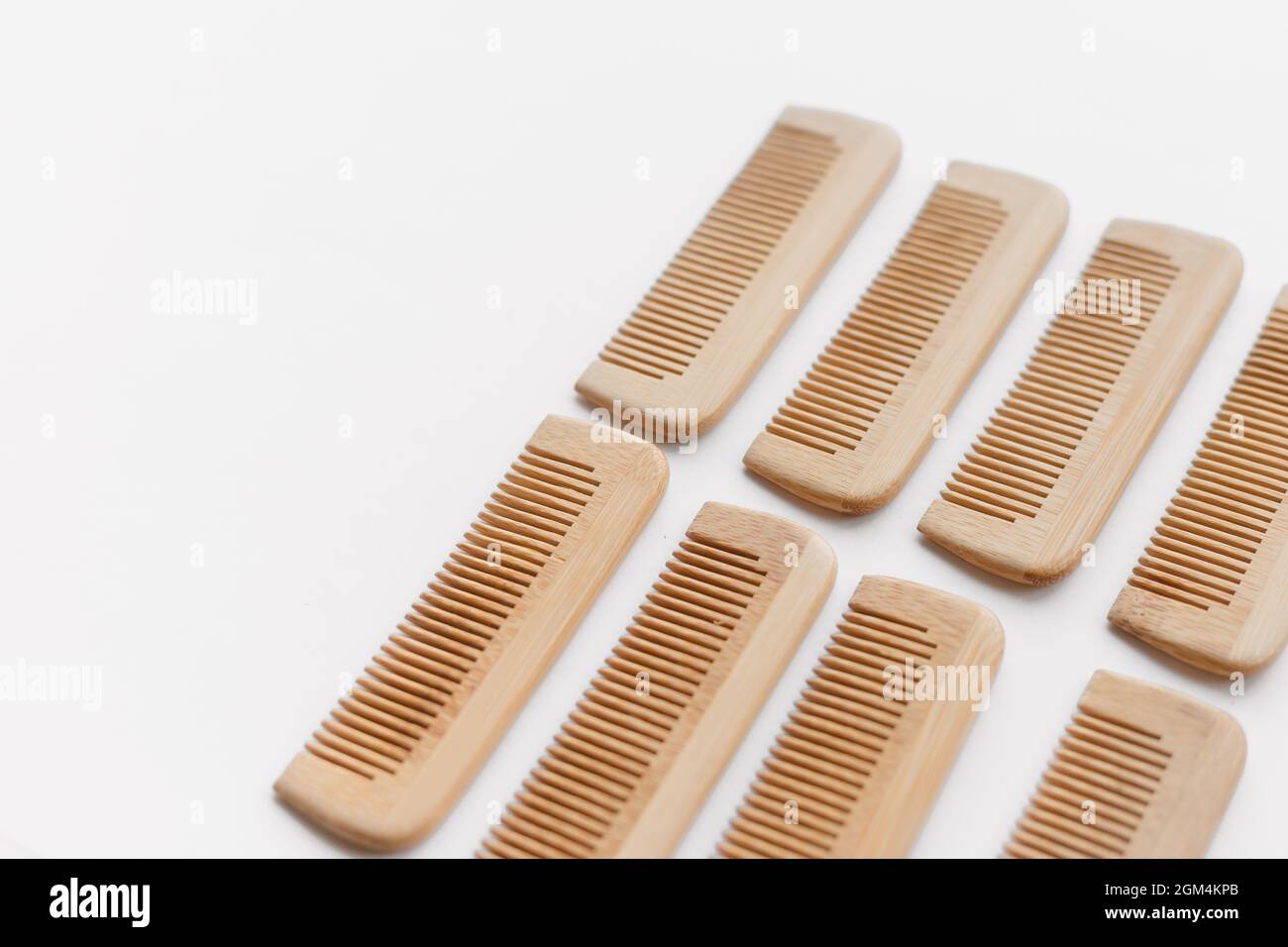 wooden combs scattered isolated on white background, flat lay, top view ...