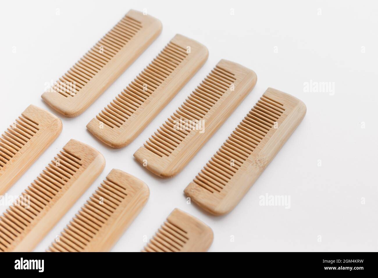 wooden combs scattered isolated on white background, flat lay, top view ...
