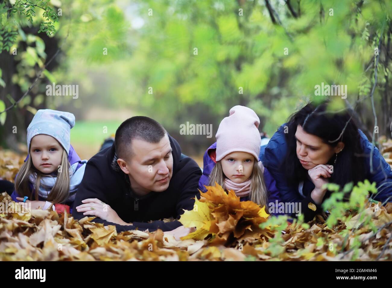 Children for a walk in autumn park. Leaf fall in the park. Family. Fall ...