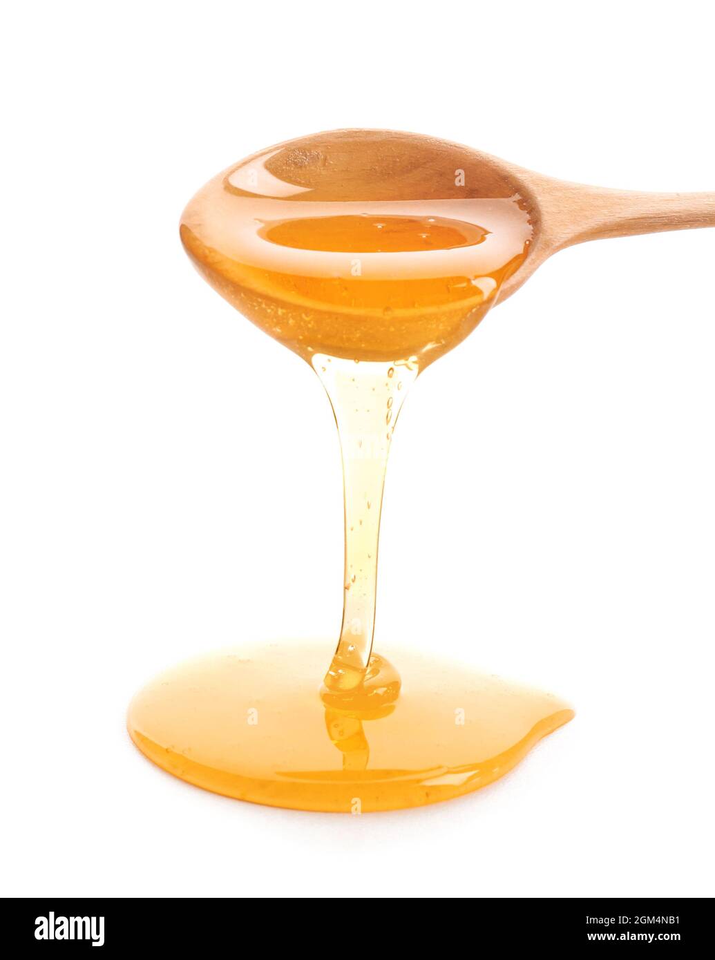 Honey dripping from spoon on white background Stock Photo - Alamy