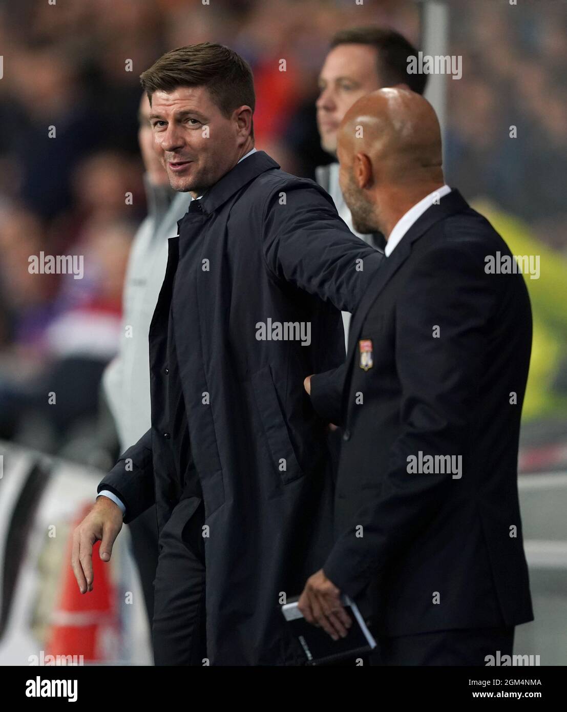 Rangers manager Steven Gerrard (left) and Lyon manager Peter Bosz ...