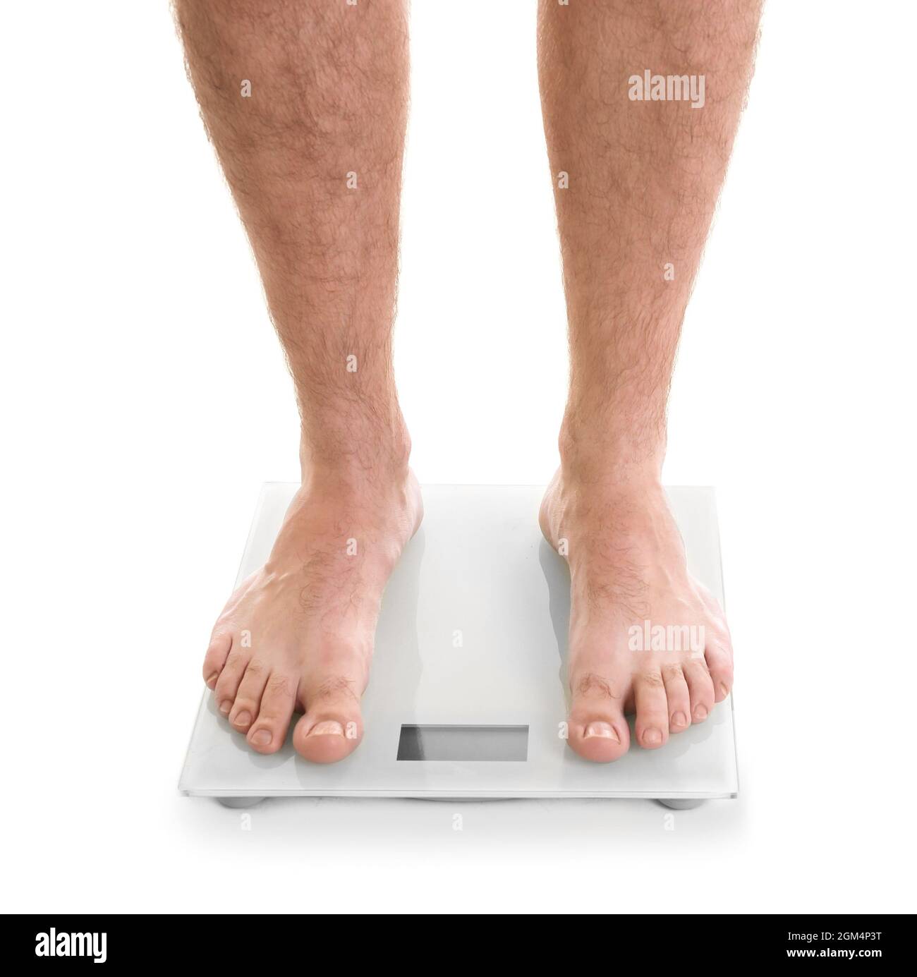 Overweight man measuring his weight using scales on white background ...