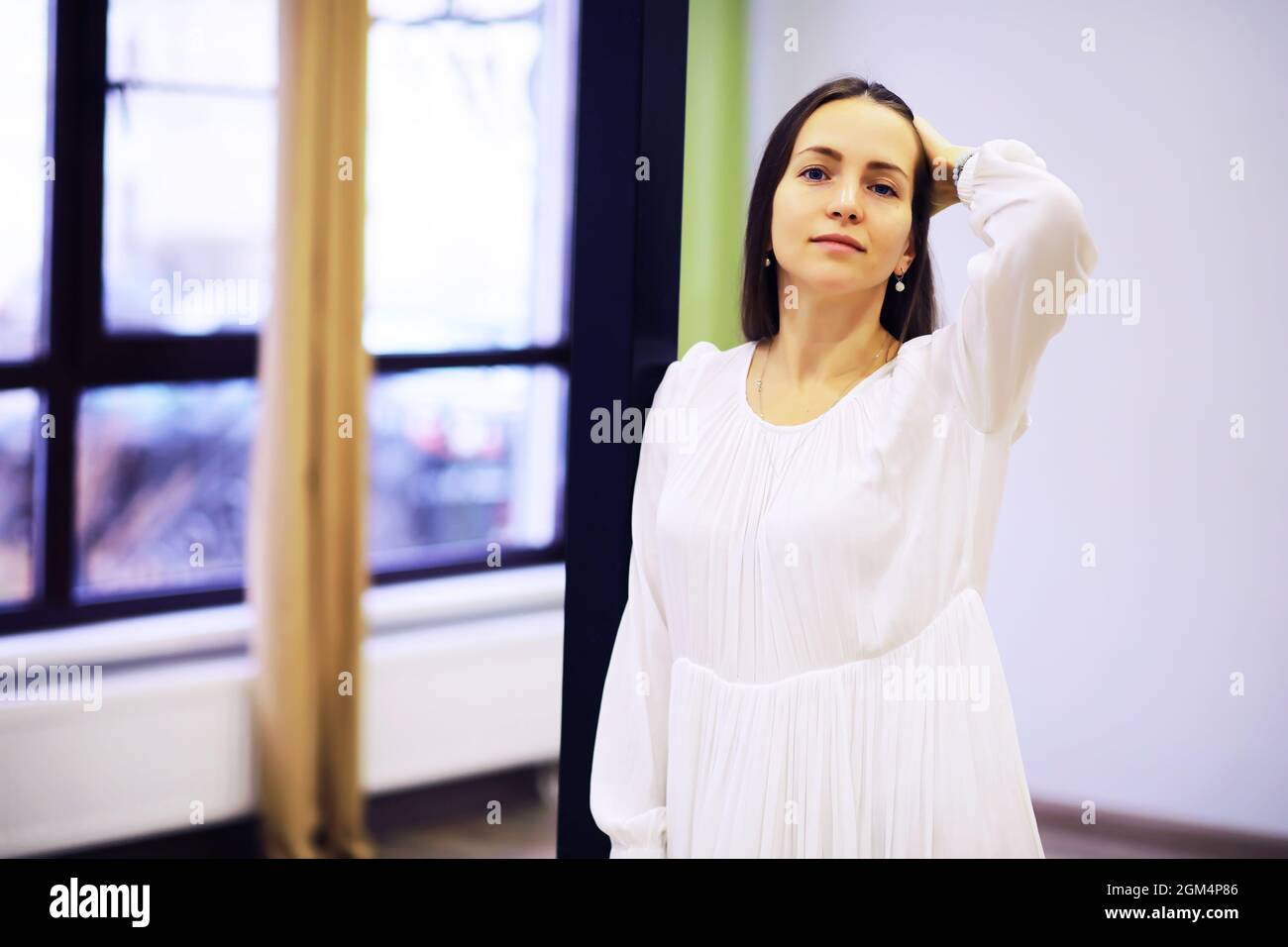 Relaxed serene pretty young woman at home, happy calm lady dream enjoy ...