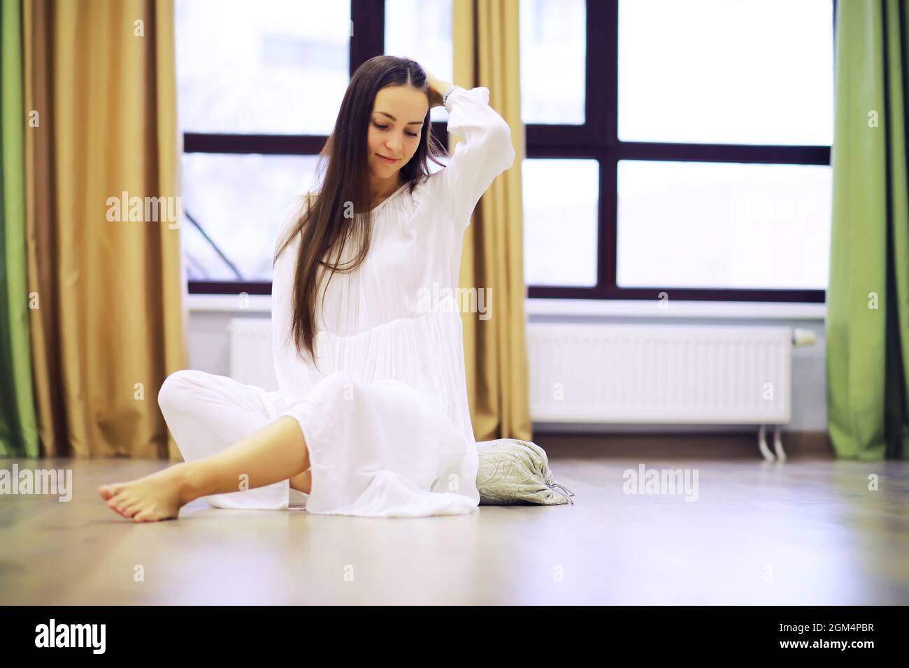 Relaxed serene pretty young woman at home, happy calm lady dream enjoy ...