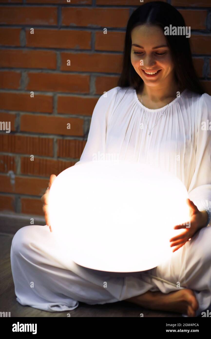 Relaxed serene pretty young woman at home, happy calm lady dream enjoy ...